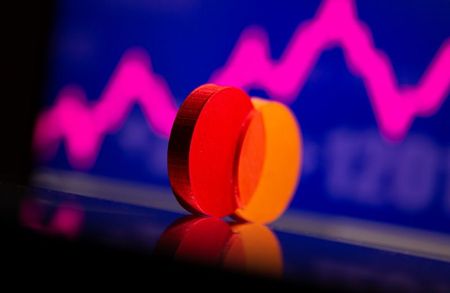 A 3D printed Mastercard logo is seen in front of | Investor Watchlist