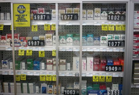 Shelves full of cigarettes are pictured at a CVS store | Investor Watchlist